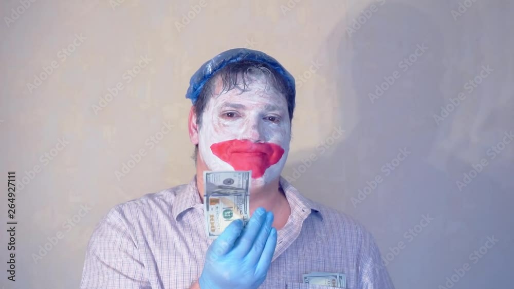 funny man mime stands with a pack of hundred dollar bills.modern Art ...