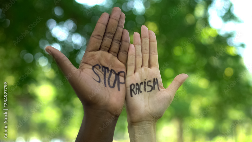 Interracial people hands with stop racism phrase, fight against ...
