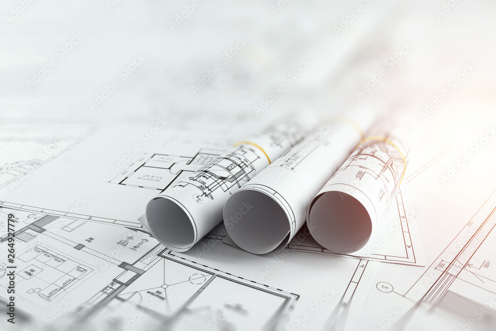 Foto Stock Architectural construction drawings twisted into a roll ...