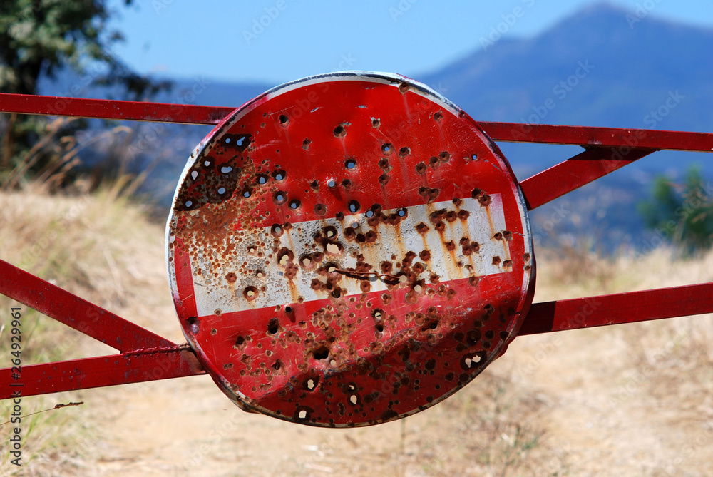 access prohibition road sign, spilled by gunshot bullets evidently of ...