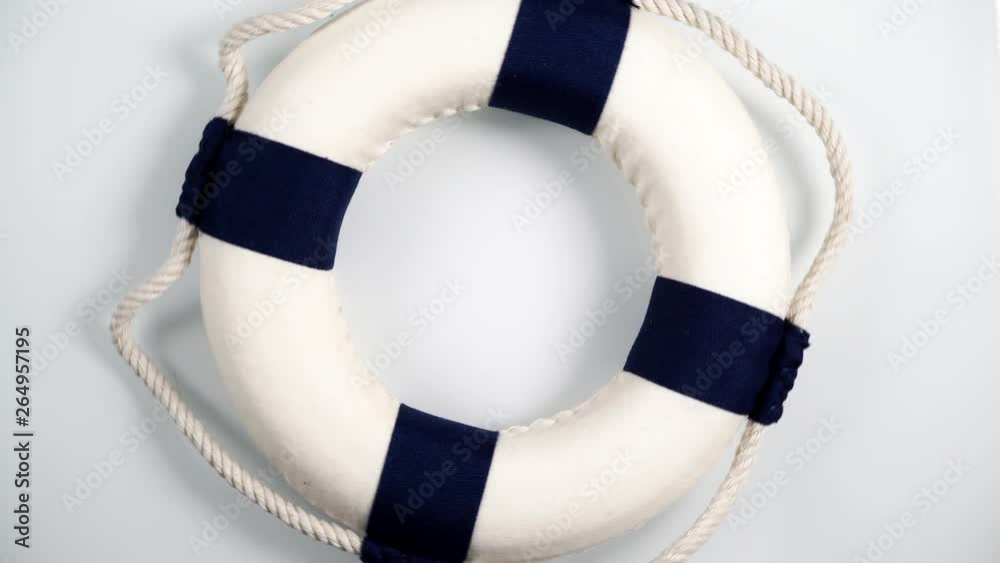 Vidéo Stock Life buoy ring lifebelt with rope rotating on white ...