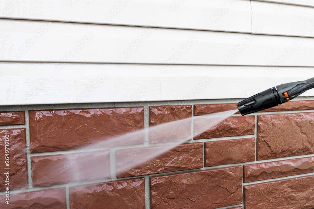 Cleaning service washing building facade with pressure water. Cleaning ...