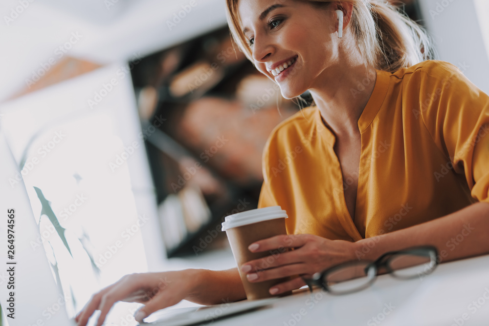 Happy office worker with wireless earphones smiling Stock Photo | Adobe ...