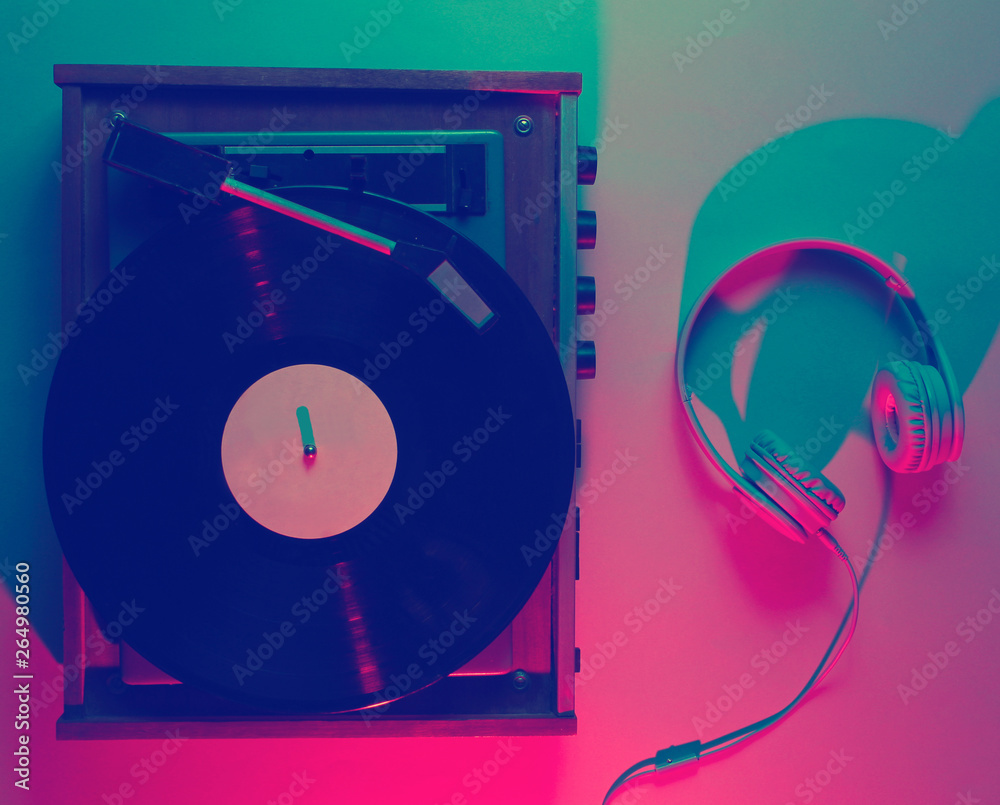 Vinyl player with lp record. Retro wave, neon light, ultraviolet ...