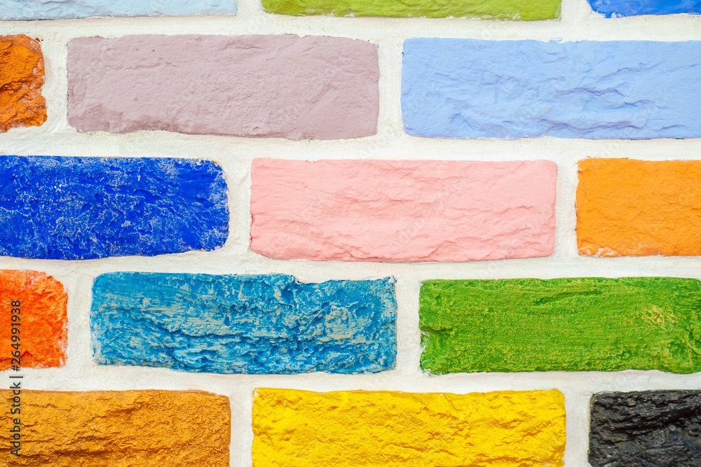Brick wall. Colored bricks. Wall painted with different colors of paint ...