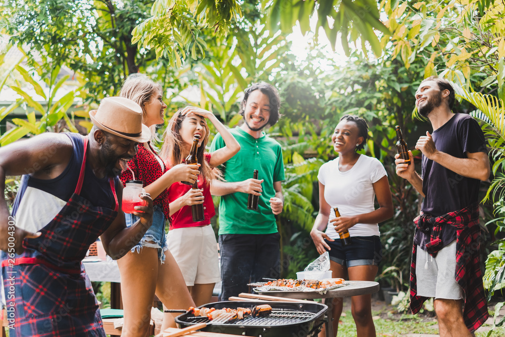 Group of diversity people having barbecue/barbeque party at home ...