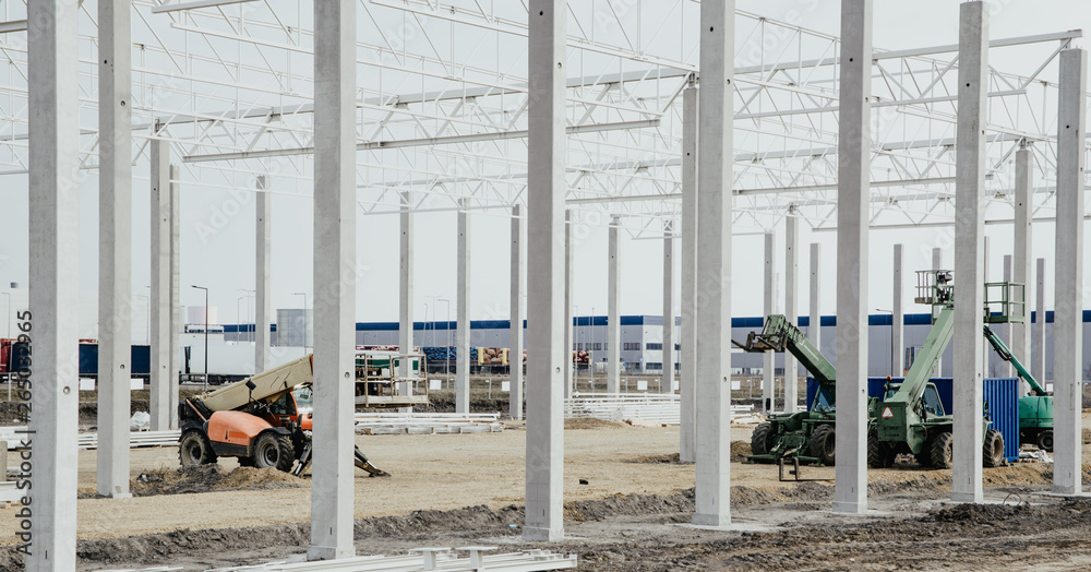 Concrete poles for the construction of the warehouse. Building a new ...