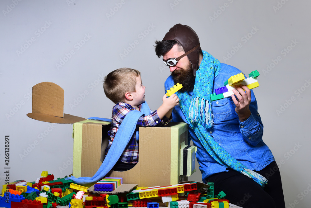 Pilot. Little boy acts as pilot and sits in cardboard plane. Funny ...
