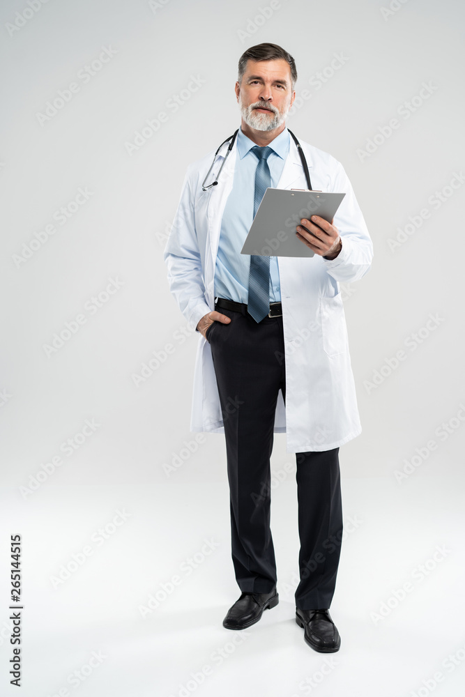 full body picture of a mature doctor holding a notepad, on white ...