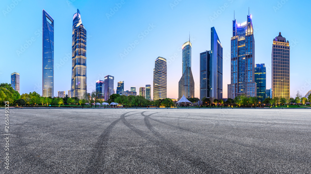 Asphalt race track ground and modern skyline and buildings in Shanghai ...