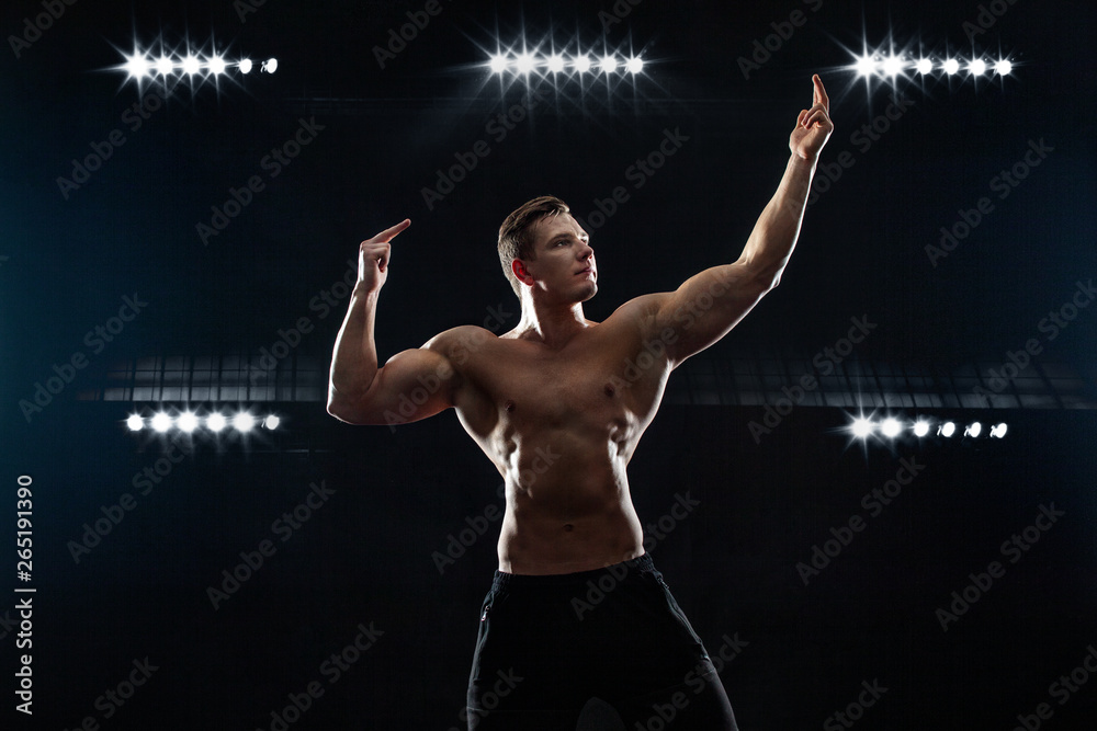 Bodybuilding competitions on the scene. Man sportsmen physique and ...