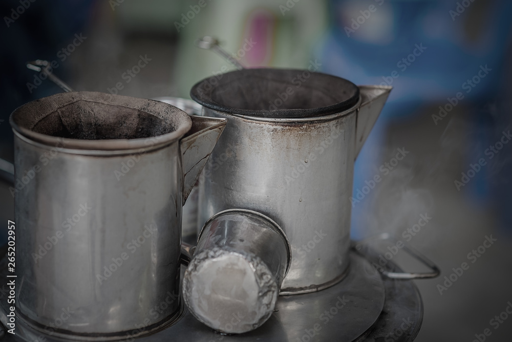 Antique coffee pot with floating smoke,Making Thai coffee using coffee ...