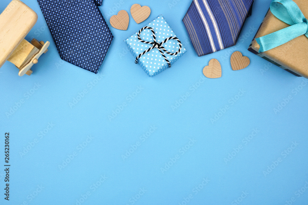 Fathers Day top border of gifts, ties and hearts on a blue background ...