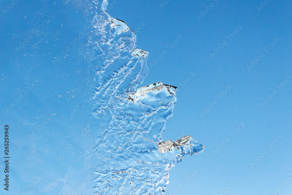 Foto de piece of thin structural ice opposite the blue sky, the concept ...