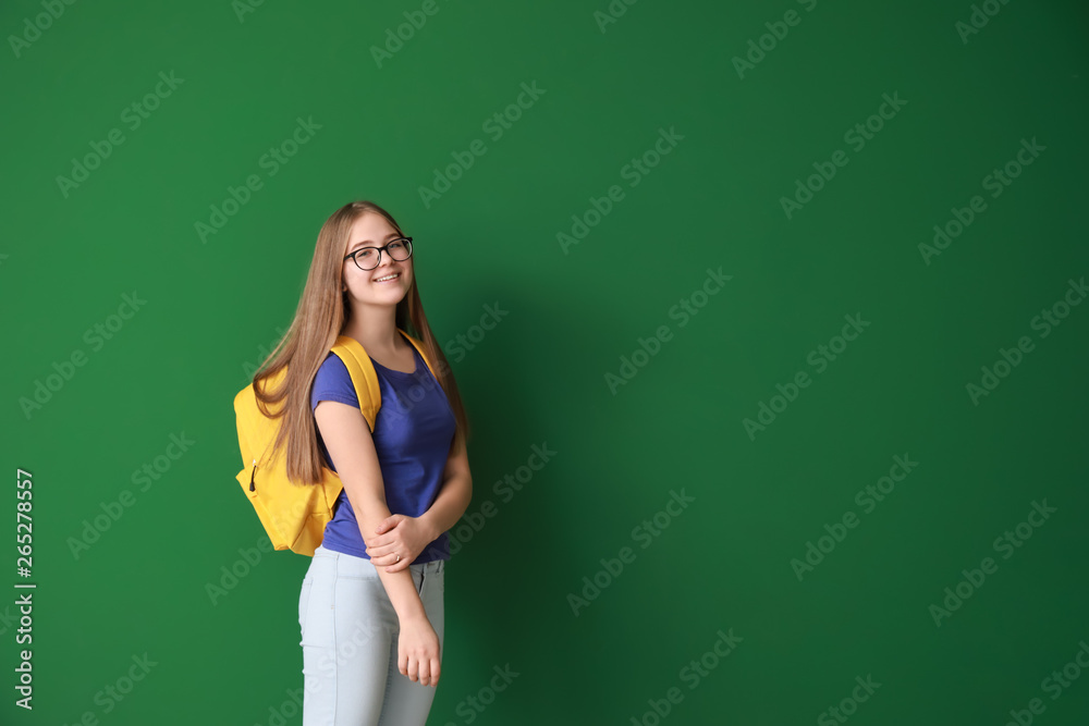 Cute teenage girl on color background Stock Photo | Adobe Stock