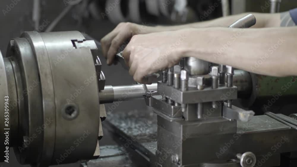 Men's hands with a Vernier caliper measuring the size of the details at ...