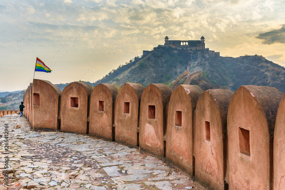 Ancient long wall with towers around Amber Fort, and view of Jaigarh ...