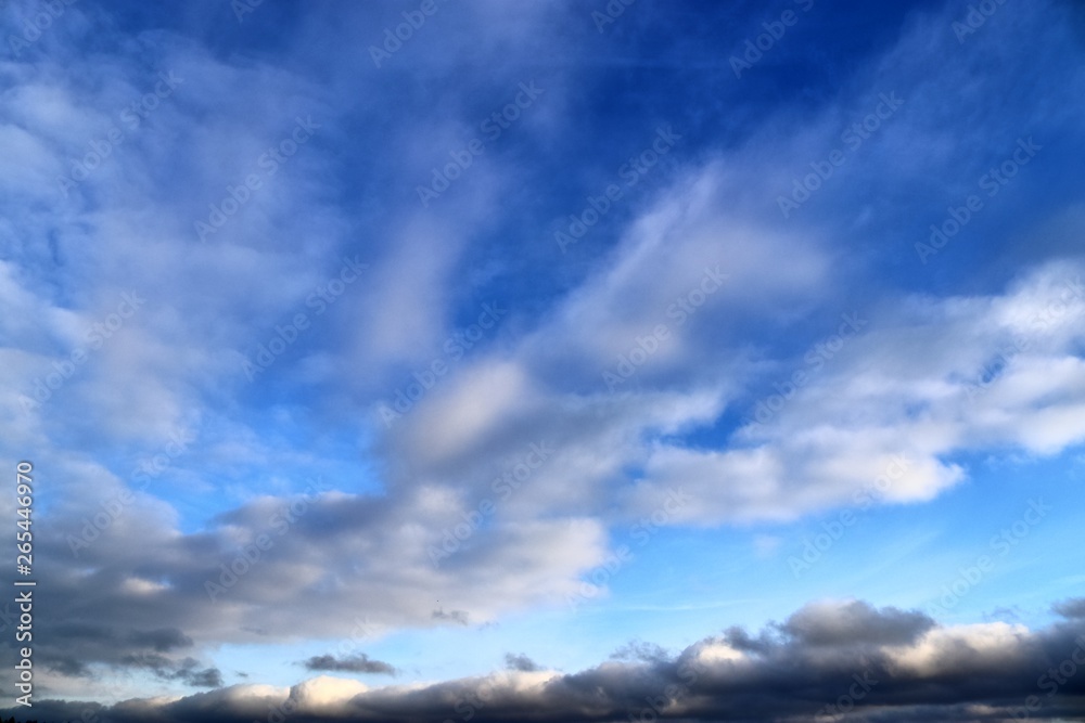 Beautiful mixed cloud formation with white and grey cumulus clouds in ...