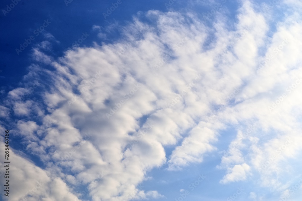 Beautiful mixed cloud formation with white and grey cumulus clouds in ...