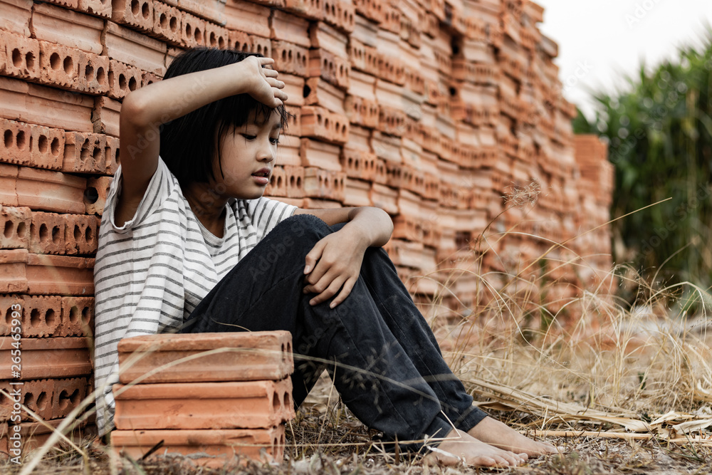 Child working in a brick factory. world day against child labor concept ...