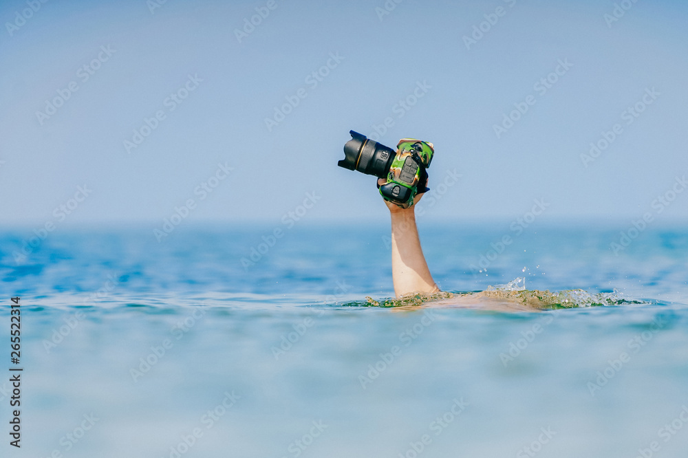 Male diver swimming under water and keeping dry and safety professional ...