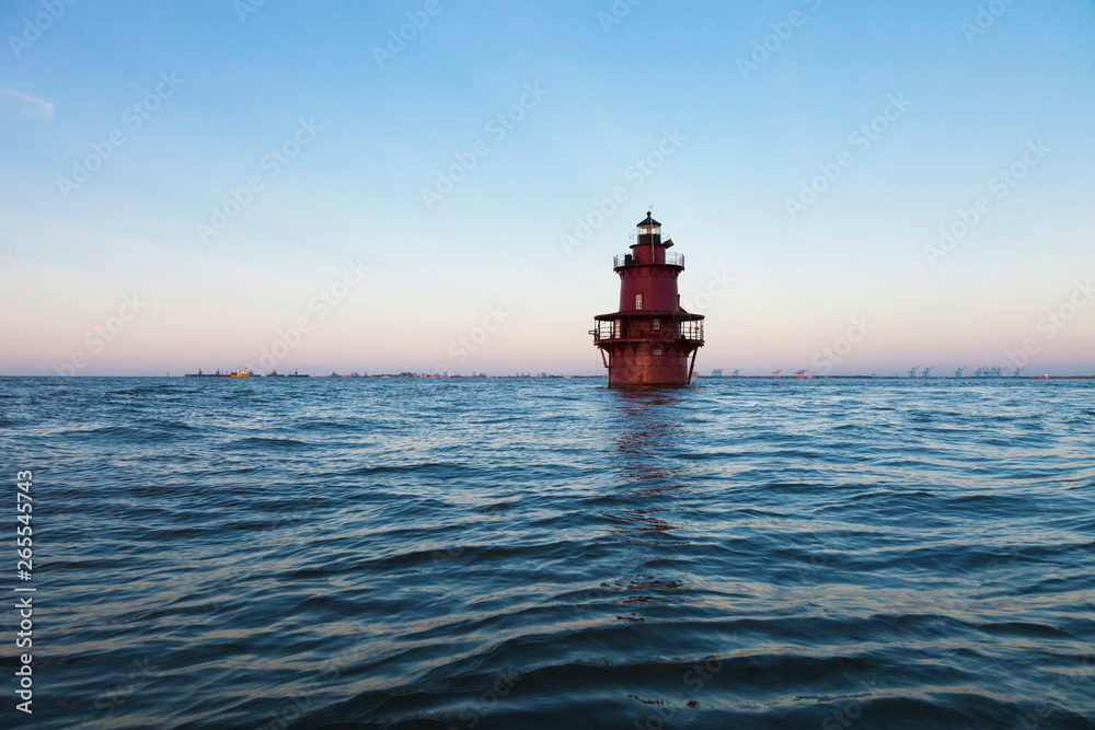 Lighthouse in ocean Stock Photo | Adobe Stock