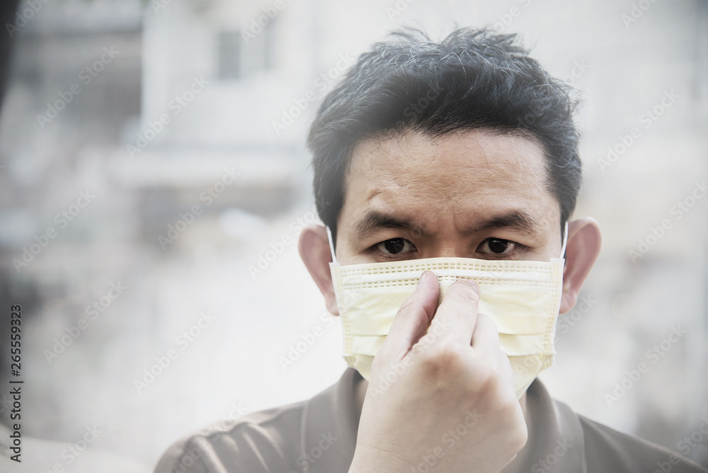 Man wearing mask protect fine dust in air pollution environment ...