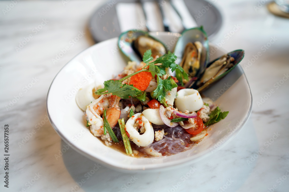 Thai spicy vermicelli (Glass noodles) salad with seafood, topped with ...
