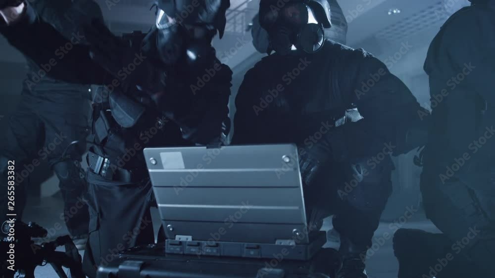 Masked Team of Armed SWAT Police Officers with Rifles are in Dark ...