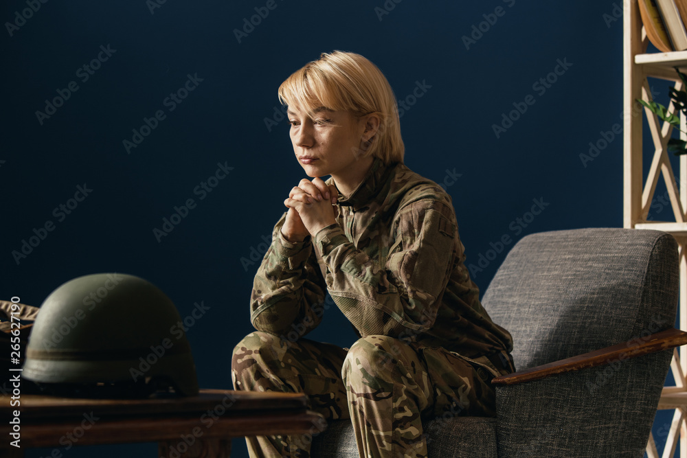 Close up portrait of young female soldier. Woman in military uniform on ...