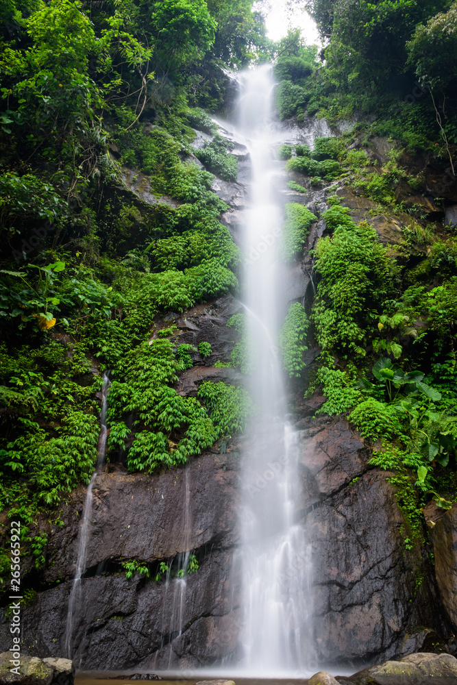 Beautiful scene of Semirang Waterfall with lovely smooth water. A ...