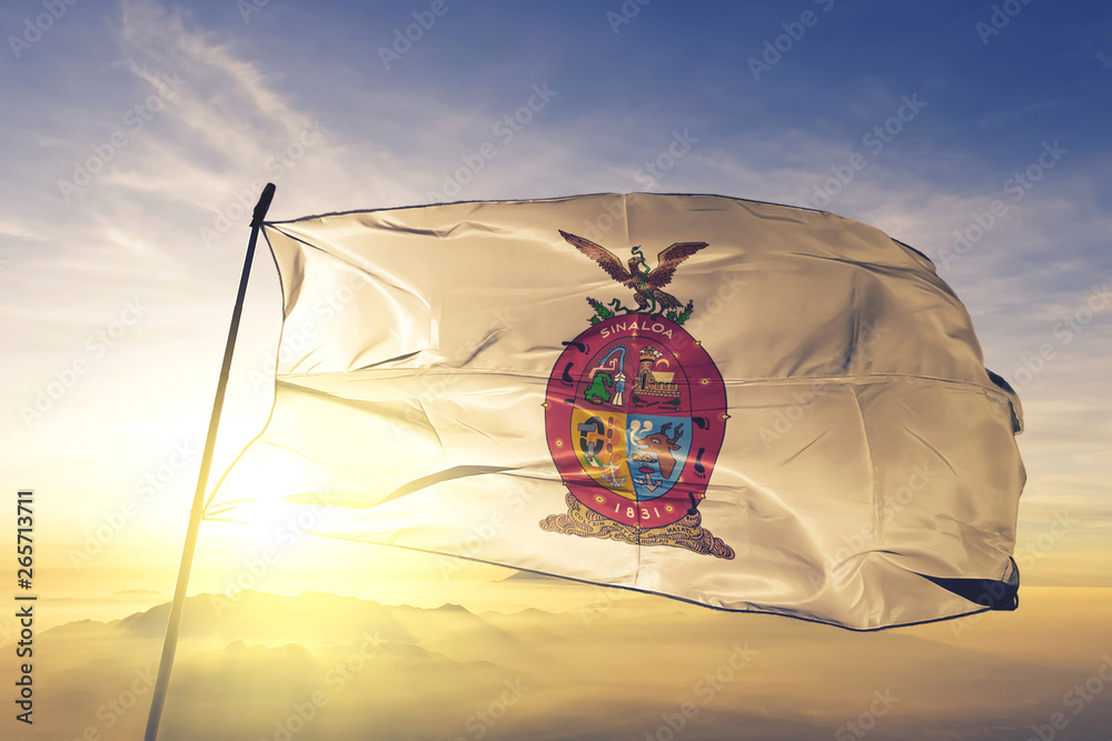 Sinaloa state of Mexico flag waving on the top sunrise mist fog foto de ...