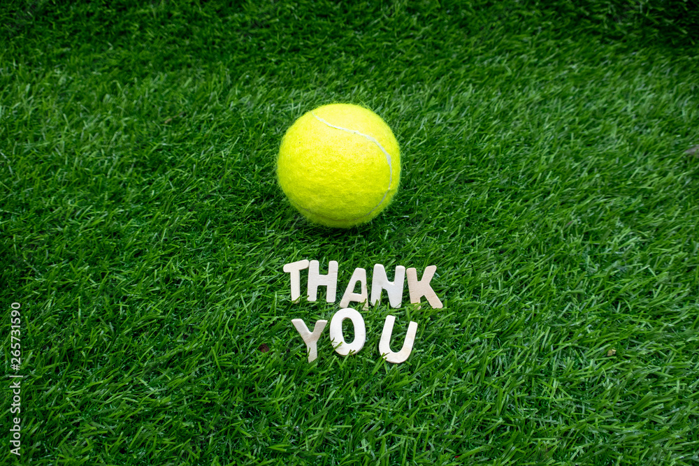 Tennis ball with thank you card on green Stock Photo | Adobe Stock