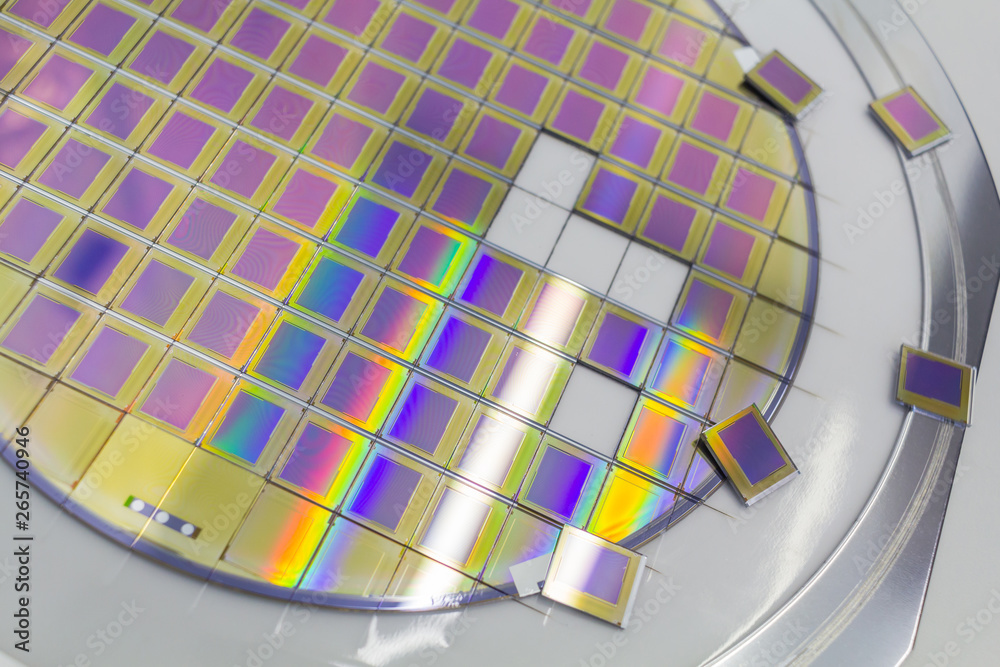 Silicon wafer with microchips fixed in a holder with a steel frame ...