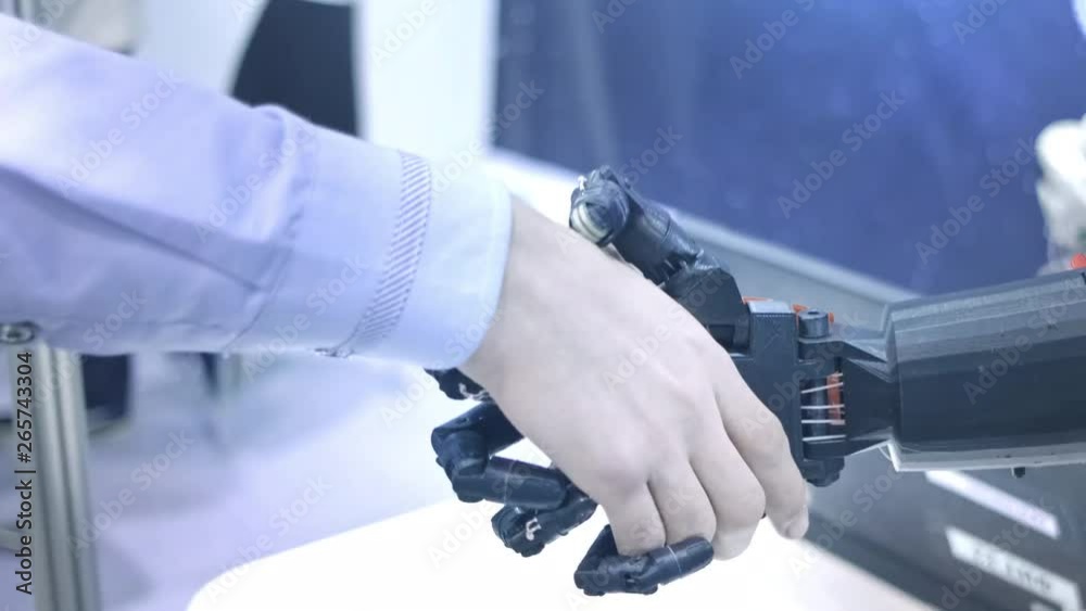 Future is now. Male hand of young student scientist inventor shakes ...