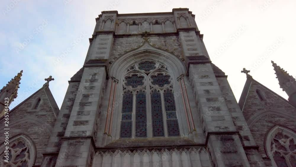 Tilt down camera in front of a church facade, reveals the entire ...