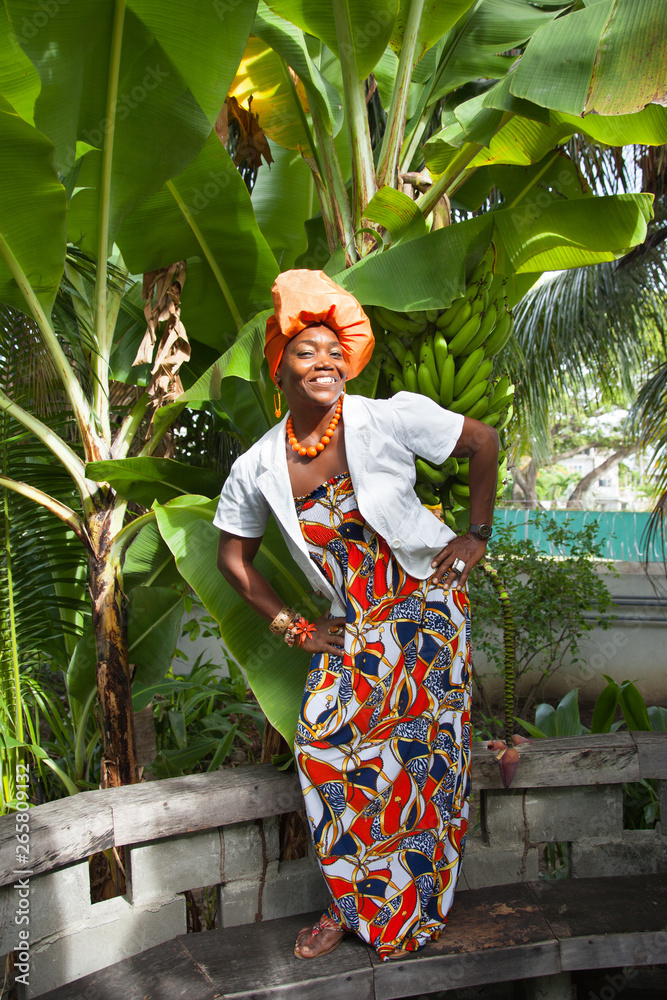 The vertical full body of a joyful African American woman wearing a ...