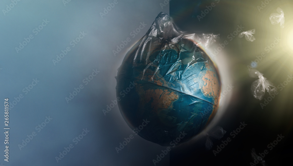 Globe of planet Earth dressed in a garbage plastic bag. Fly around the ...