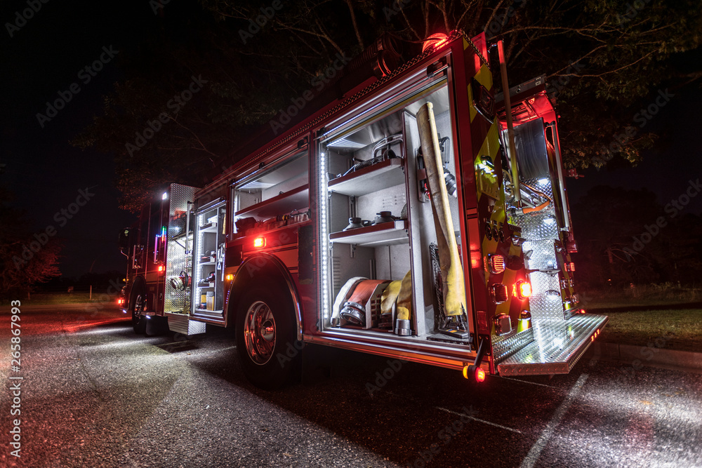 Fire truck glowing in the dark with all lights on. Stock Photo | Adobe ...