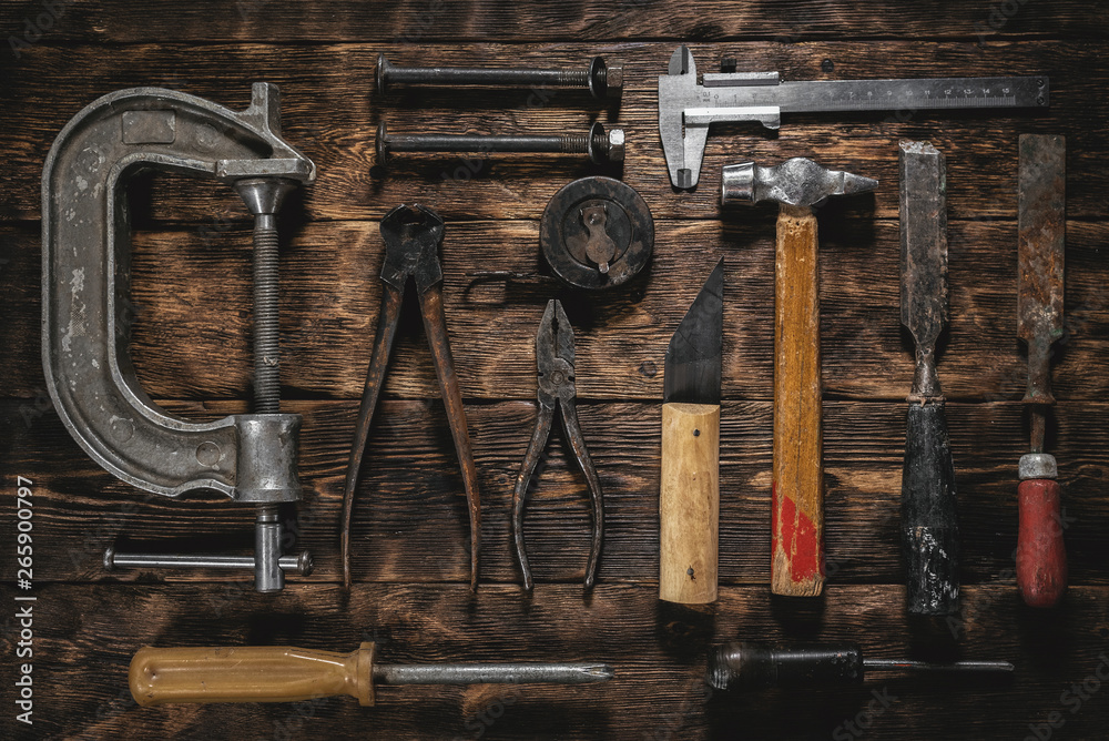 Old construction tools on a wooden workbench flat lay background ...