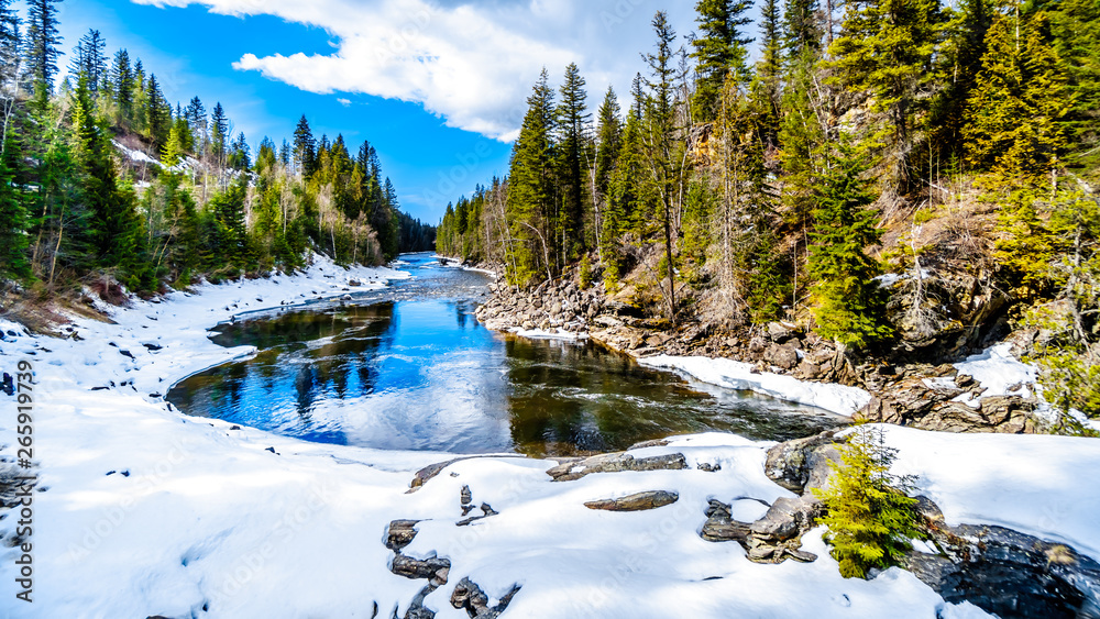 Water of the Murtle River tumbles over the edge of the partly frozen ...
