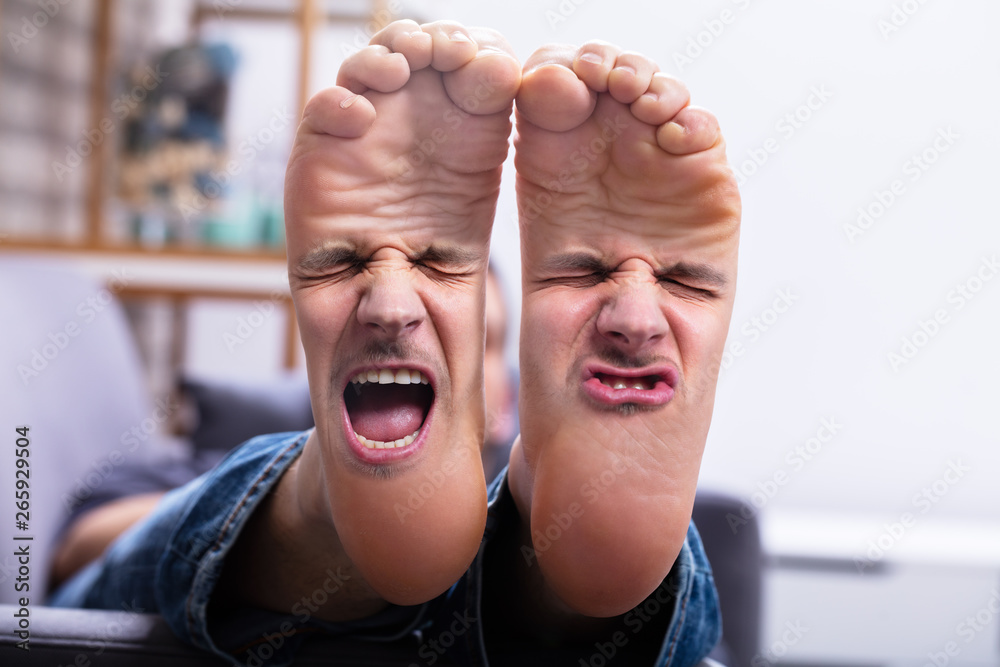 Feet With Painful Facial Expression Stock Photo | Adobe Stock