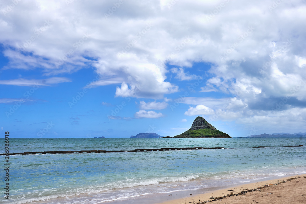 A view of the Chinaman's Hat island seen from a beach near the Kualoa ...