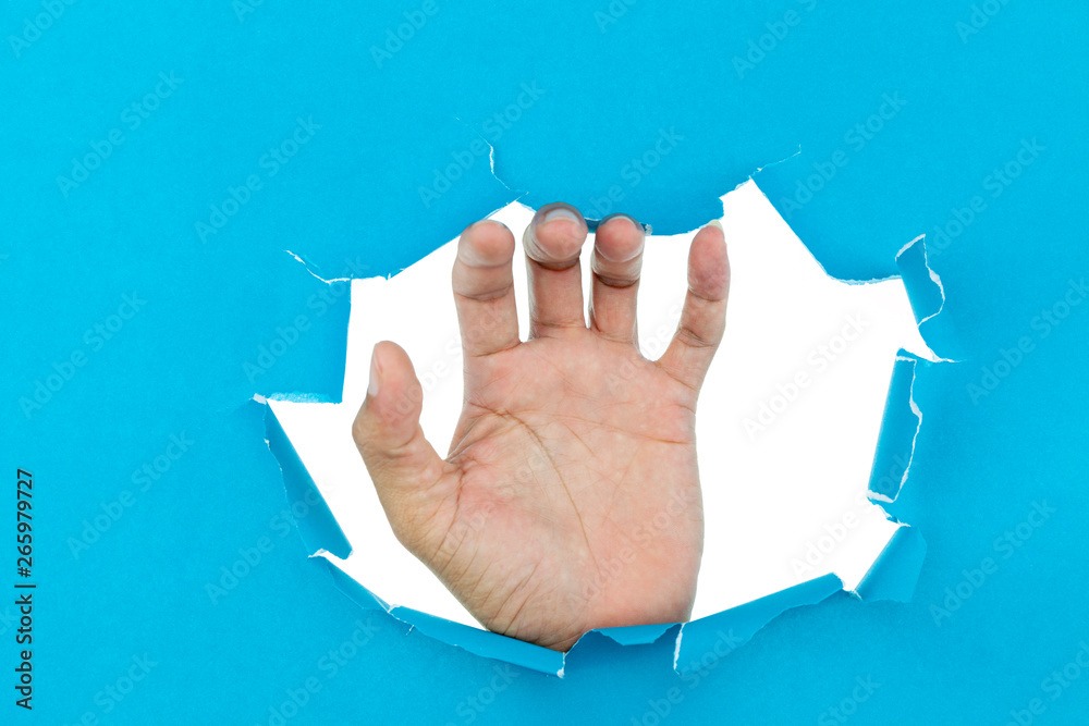 male hand ripped blue paper on white background,space for your message ...