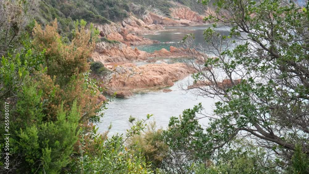 Path from Galeria to Girolata. Typical red cliffs of volcanic origin ...