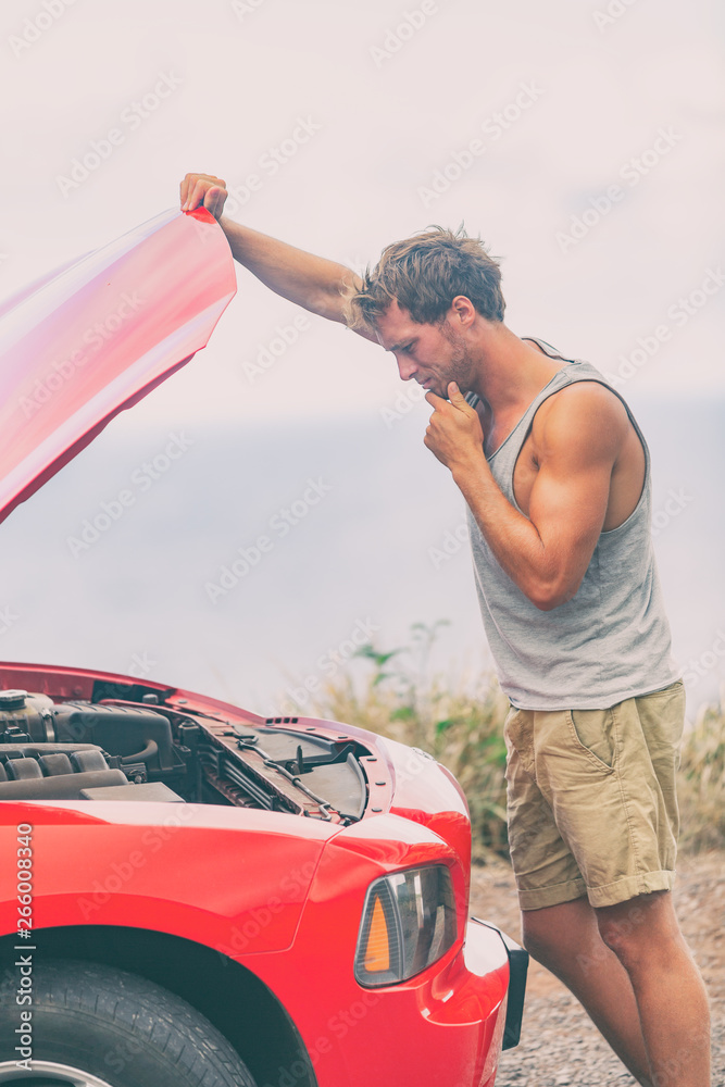 Car breakdown problem. Road trip travel young man on side of the road ...