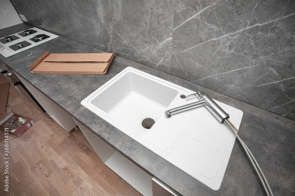 Installation new mixer tap. Unpacking and setting faucet. Plumber fixes ...