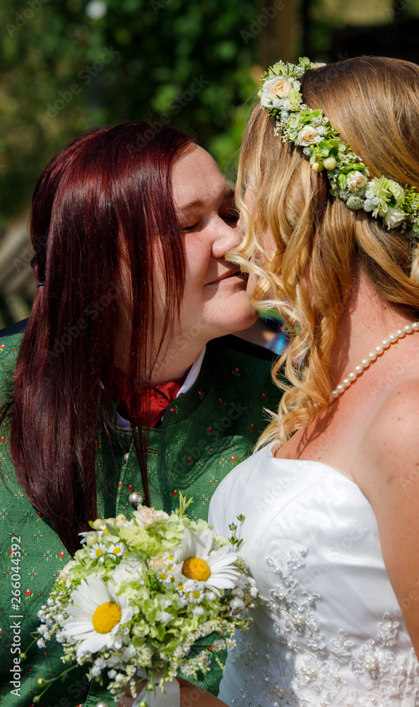Young pretty marriage couple smiling and kissing intimately at summer ...