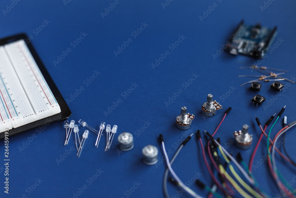 DIY electronic kit on the blue background, FLAT LAY, variety of sensor ...