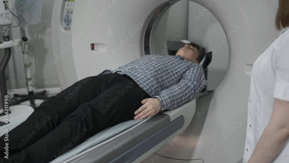 Male Patient On The Ct Or Mri Scanner Machine During X-Ray Process ...